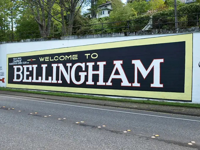 The welcome sign says it all – no fancy slogans needed when your town's name has enough character to stand on its own.