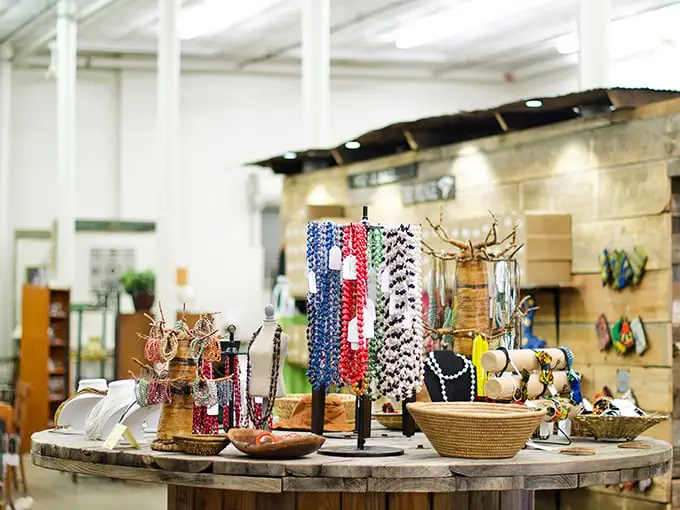 A circular table of possibilities—where beaded necklaces, woven baskets, and handcrafted treasures create a global marketplace in miniature.
