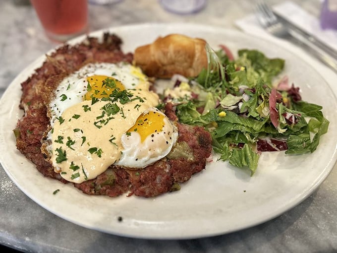 Corned beef hash topped with eggs and hollandaise – breakfast nirvana achieved! This plate has "nap afterward" written all over it.