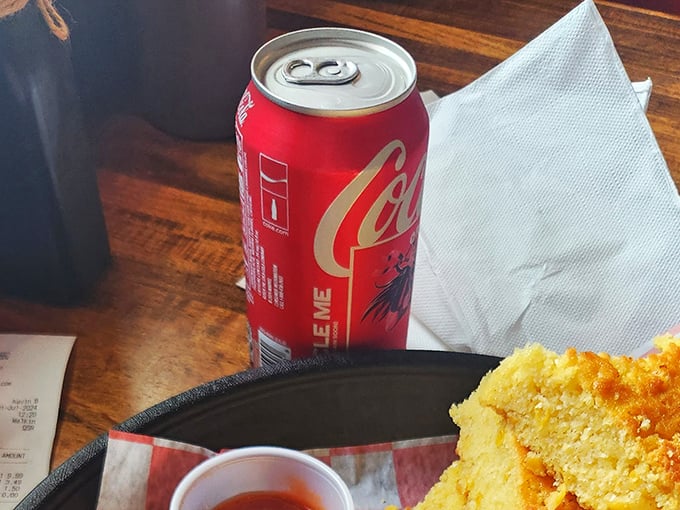 Even the beverages keep it real—a classic Coca-Cola in a can, because some things don't need fancy glassware to hit the spot.