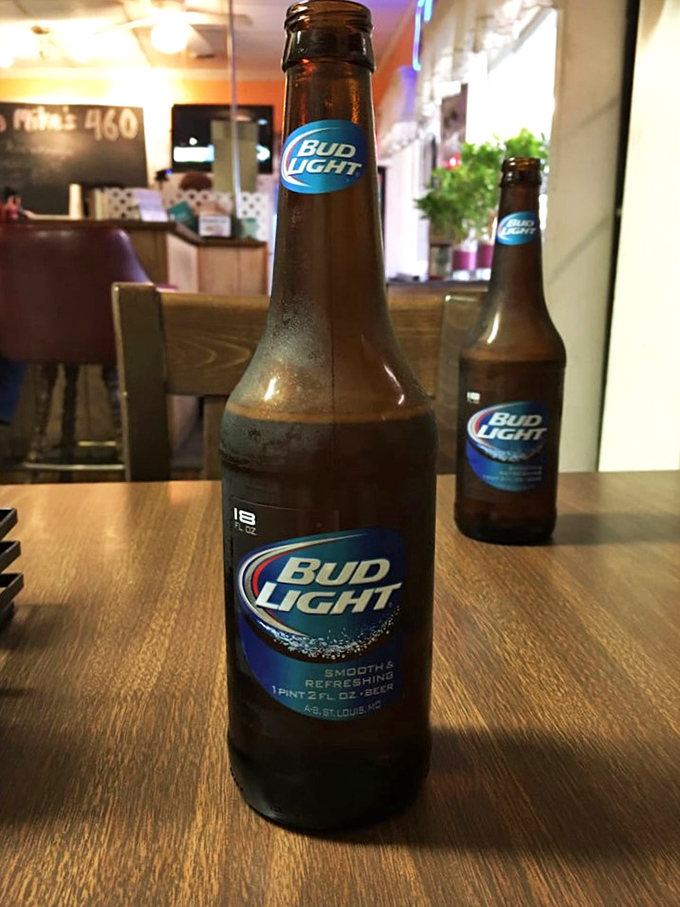 Cold beer in a warm burger joint—a simple pleasure that reminds us some perfect pairings never need upgrading.