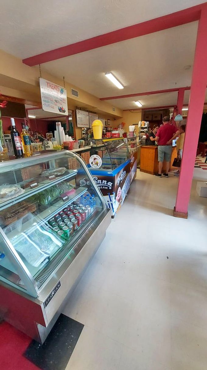 Pink pillars and vintage display cases—this ice cream parlor isn't just selling scoops; it's selling a trip back to when calories didn't count and sprinkles solved everything.