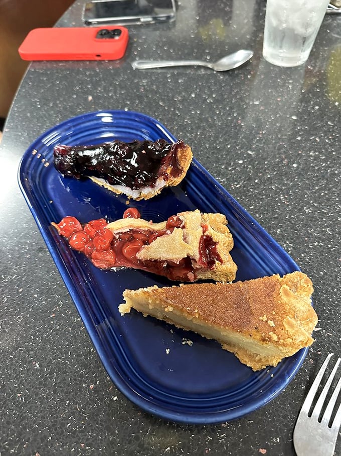 The pie flight—three different slices of heaven on one plate. Like choosing favorite children, but deliciously acceptable.