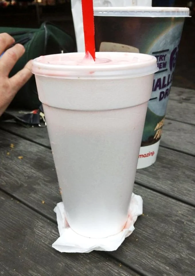 That strawberry shake isn't just a drink—it's dessert in disguise, wearing a straw like a fancy hat at the Kentucky Derby of dairy treats.