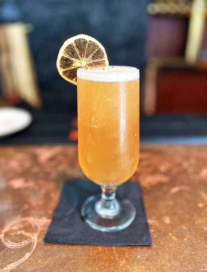 This sunlit shandy with its perfect lemon garnish is summer in a glass—the kind of refreshment that makes Massachusetts heat waves bearable, even pleasant.