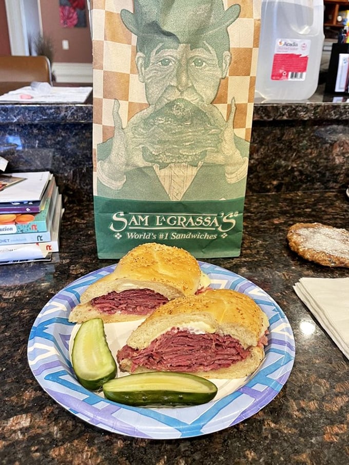 The cross-section reveals the truth: perfectly stacked corned beef with just the right ratio of sauerkraut and cheese.