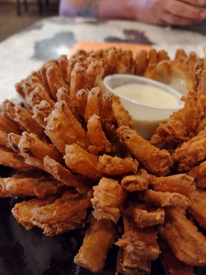 The Brangus Tumbleweed isn't just an appetizer—it's an engineering marvel of crispy onion strands that somehow maintains structural integrity until the last bite. 