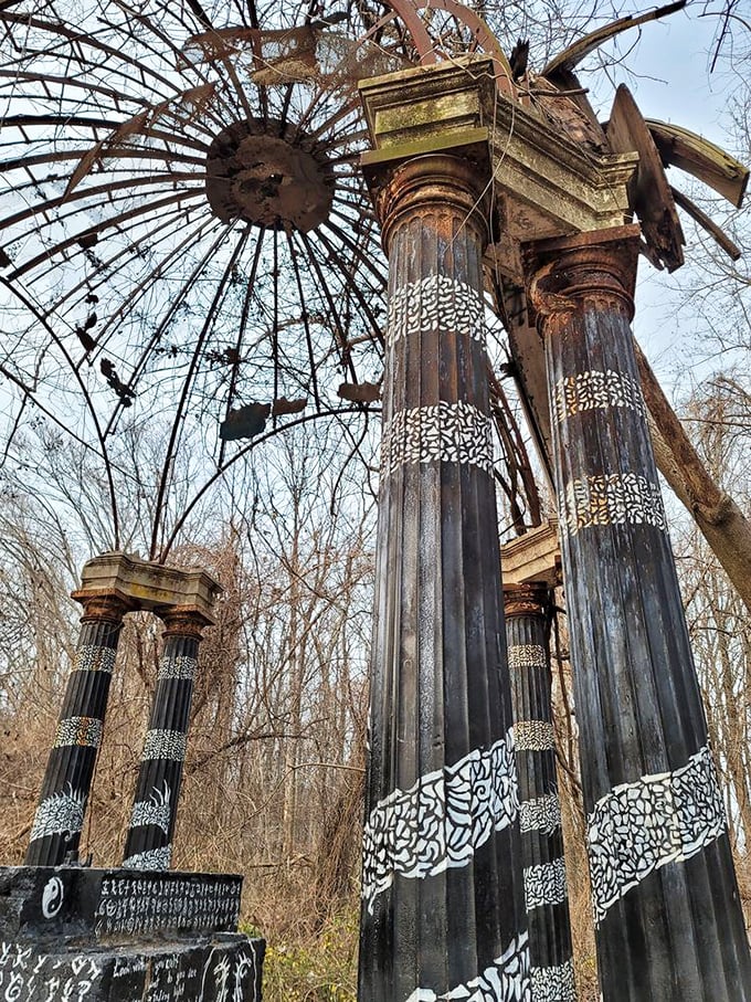 Columns reaching skyward like ancient sentinels, their weathered surfaces now canvases for modern expression—beauty and decay in perfect tension.