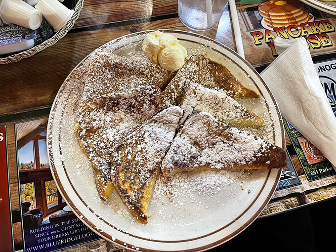 French toast that's been transformed into a powdered sugar masterpiece—like breakfast wearing its Sunday best.