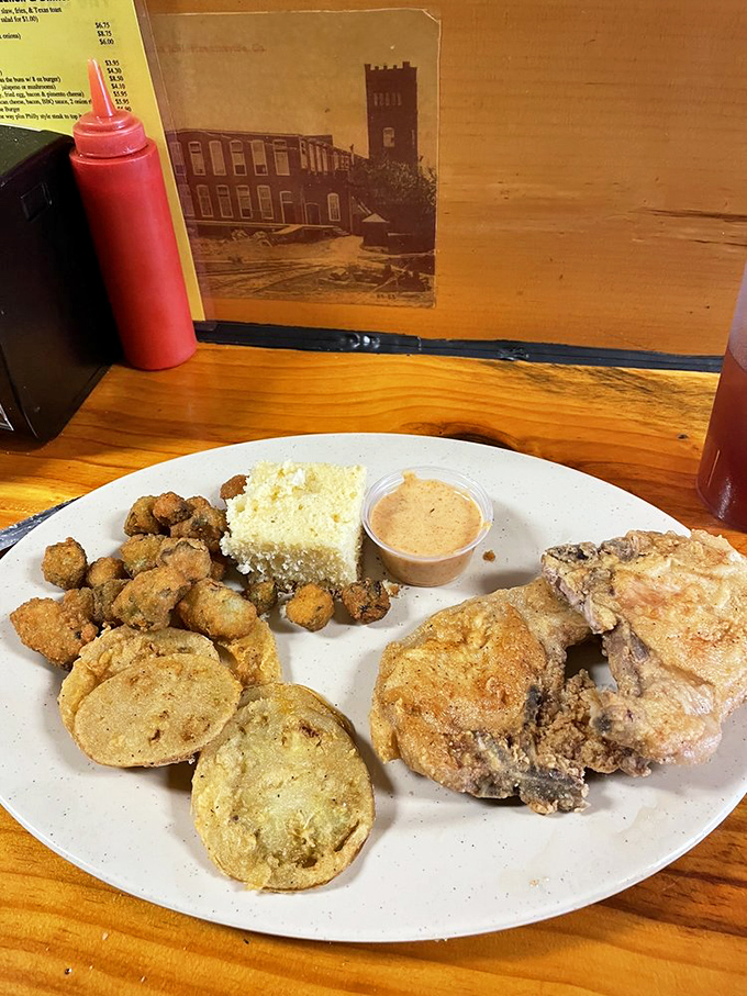 Southern lunch plates don't mess around—crispy fried pork chops with all the fixings that remind you grandma didn't raise no fool.