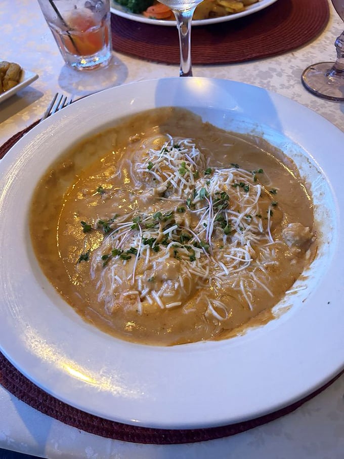 This lobster ravioli doesn't just swim in sauce—it performs synchronized swimming routines that deserve a perfect score from your taste buds. 