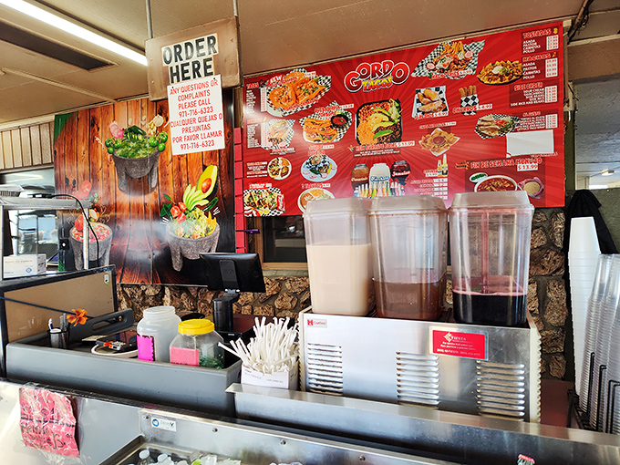 The ordering counter might not have white tablecloths, but it's where culinary magic begins with three dispensers of liquid gold—horchata, jamaica, and tamarindo. 
