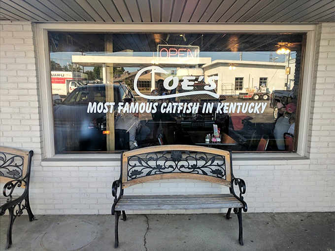 Most Famous Catfish in Kentucky isn't just a claim—it's a promise etched in glass. The bench invites you to rest while your appetite builds.