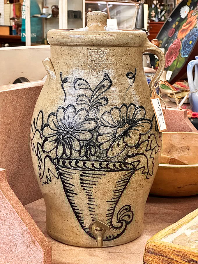 This hand-decorated stoneware water cooler tells stories of summer gatherings before air conditioning was even a dream. Folk art that actually did something.