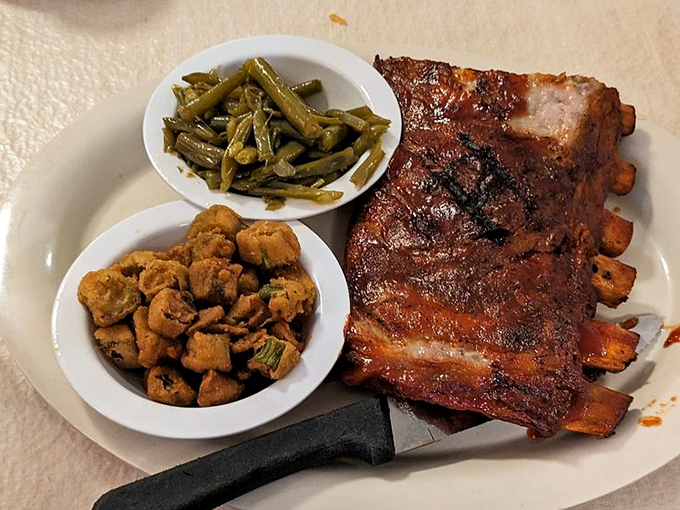 Those ribs look like they've been slow-dancing with smoke and fire so long they're ready to propose marriage to your taste buds.