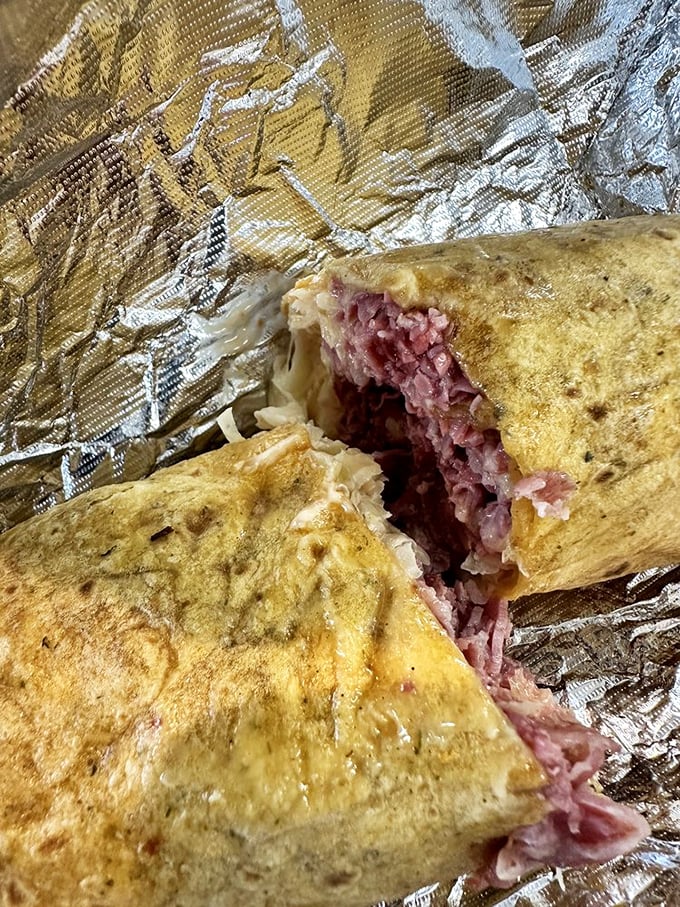Not all heroes wear capes—some come wrapped in grilled rye. This corned beef creation has the structural integrity of the Brooklyn Bridge.