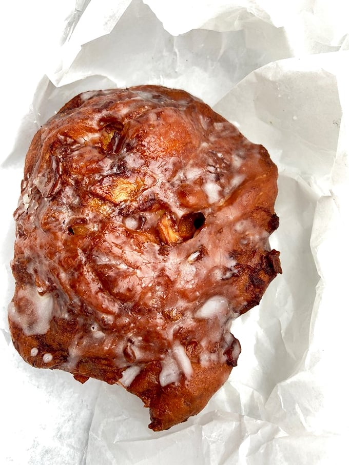 The Michelangelo of apple fritters has struck again! Glazed, glistening, and approximately the size of a small planet—breakfast perfection exists.