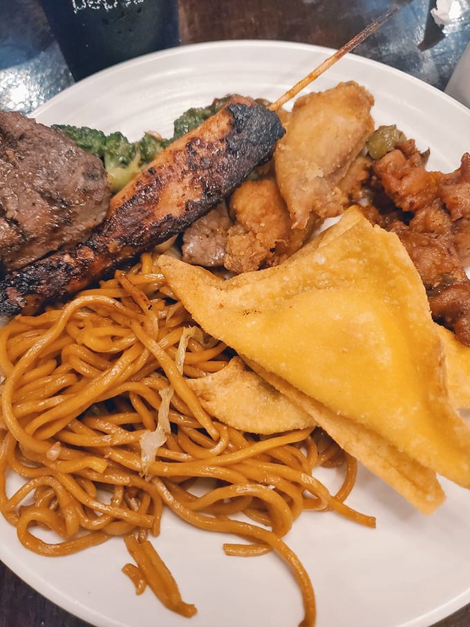 The plate that tells the story of buffet expertise—a little of everything, perfectly balanced. This isn't amateur hour; this is strategic buffet architecture.