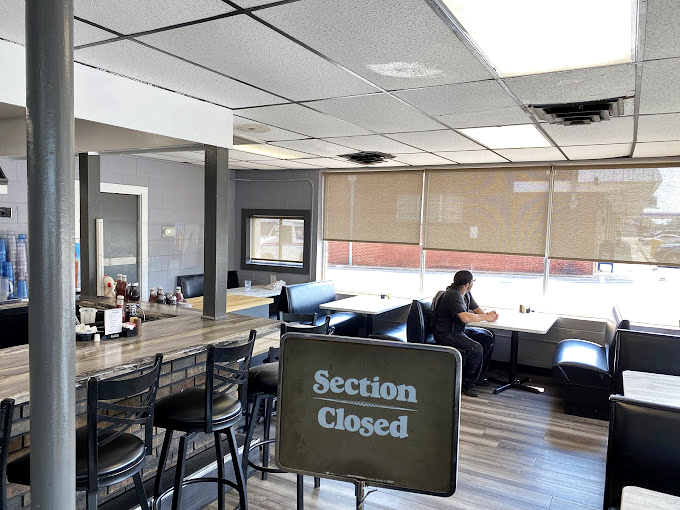 A dining area that whispers "take your time" while somehow serving everyone efficiently—the magic of a well-run pancake house.