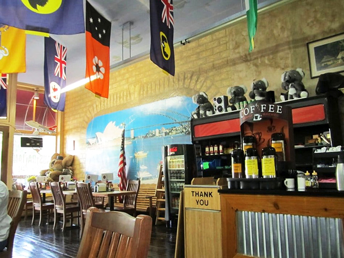 Australian flags hang proudly above a coffee counter that means business. Those stuffed koalas aren't just cute—they're quality control supervisors.