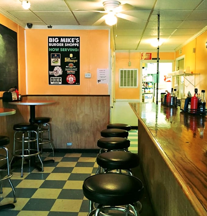 The counter seating isn't just functional—it's front-row tickets to the greatest show on earth: watching your burger being born.