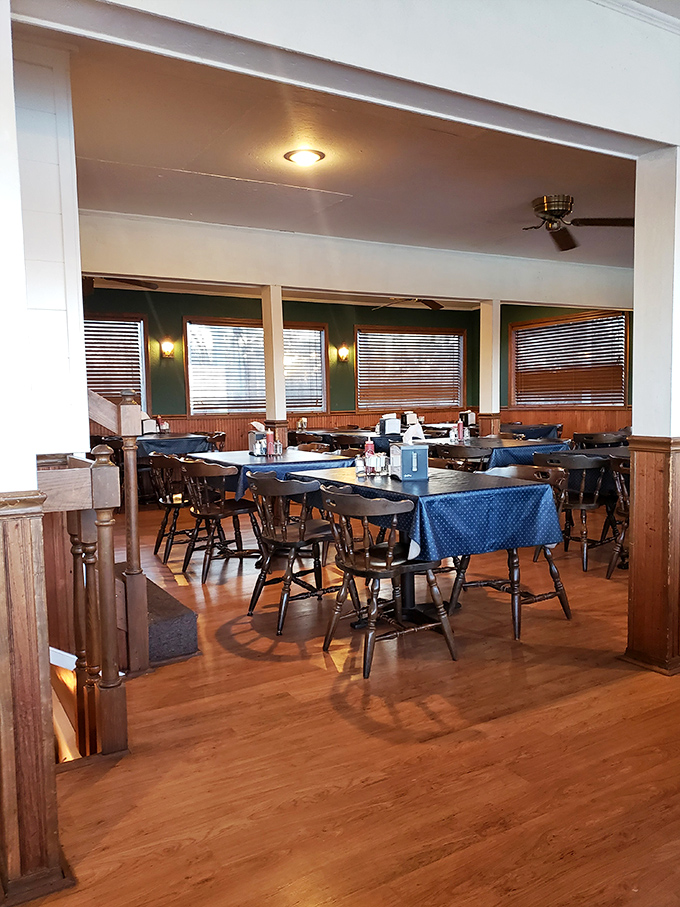 The dining room feels like a riverboat that decided to settle down and serve incredible food instead of traveling.