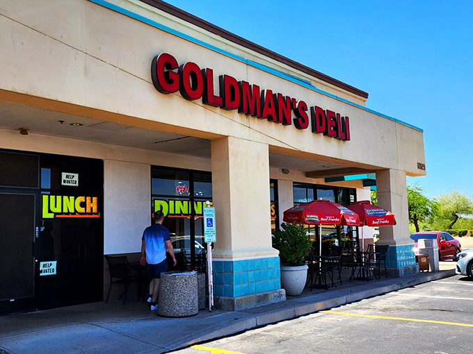 The bright red sign of Goldman's Deli stands out like a beacon of hope for the hungry and homesick. Comfort food paradise awaits!