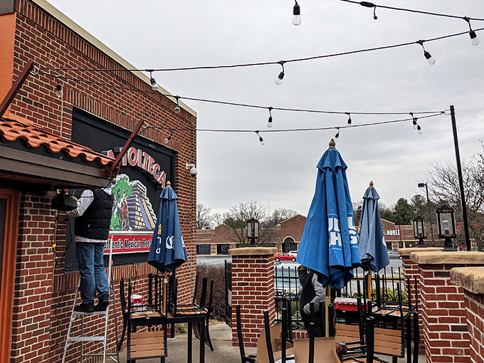 La Tolteca's sunny yellow exterior with terracotta roof stands like a beacon of culinary promise against Delaware's sky. No architectural awards here—just the promise of authentic flavors inside.
