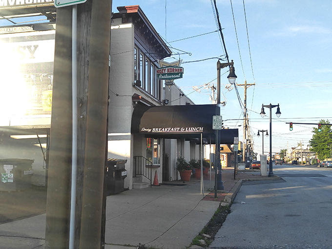 The unassuming black awning of Kozy Korner beckons like a secret handshake among breakfast aficionados. No flash, all substance.