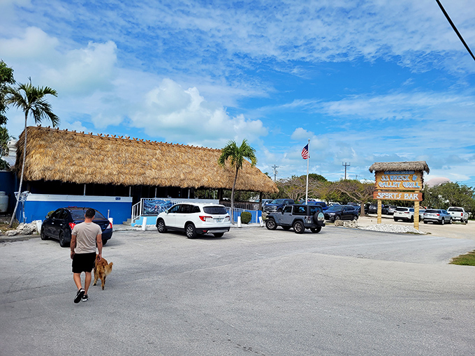 The thatched roof and blue ramp welcome you like an old friend. This is Florida Keys authenticity at its finest—no pretense, just promises of great food ahead.