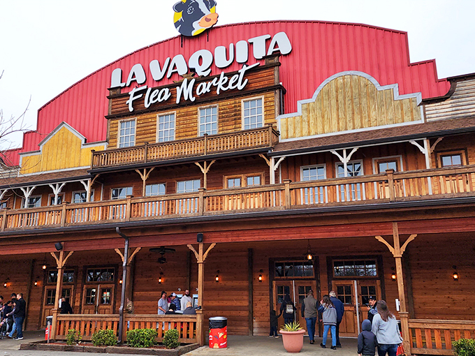 The unmistakable red barn facade of La Vaquita welcomes treasure hunters with autumn's fiery maples standing guard like colorful sentinels of bargain paradise.
