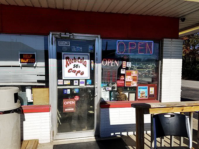 The classic red-roofed exterior of Rock-Cola 50's Cafe promises a time warp before you even step inside. That vintage Corvette mural isn't just decoration—it's a preview of coming attractions.