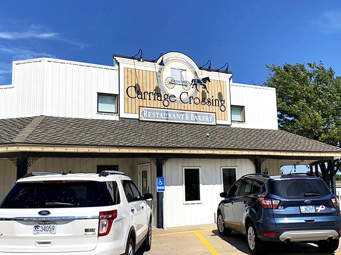 The blue and white exterior of Carriage Crossing stands against a Kansas blue sky like a beacon of comfort food hope in Yoder's Amish country.