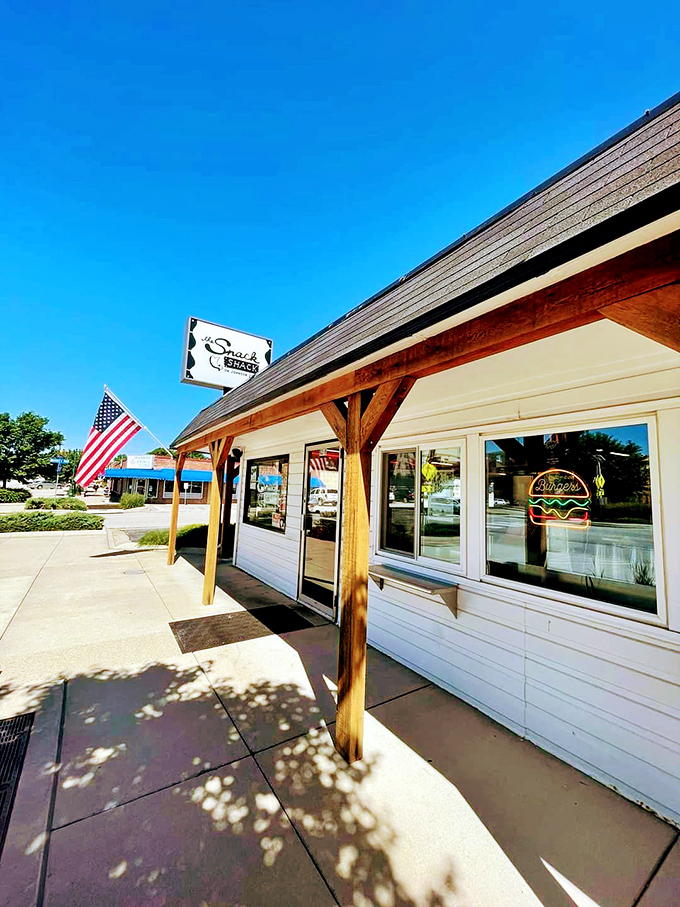 The humble white exterior of The Snack Shack belies the flavor explosions happening inside. American flag included—because patriotism tastes delicious.