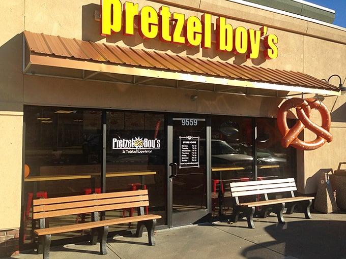 The bright yellow sign of Pretzel Boy's beckons like a carb-loving lighthouse, promising twisted delights within this Overland Park storefront.