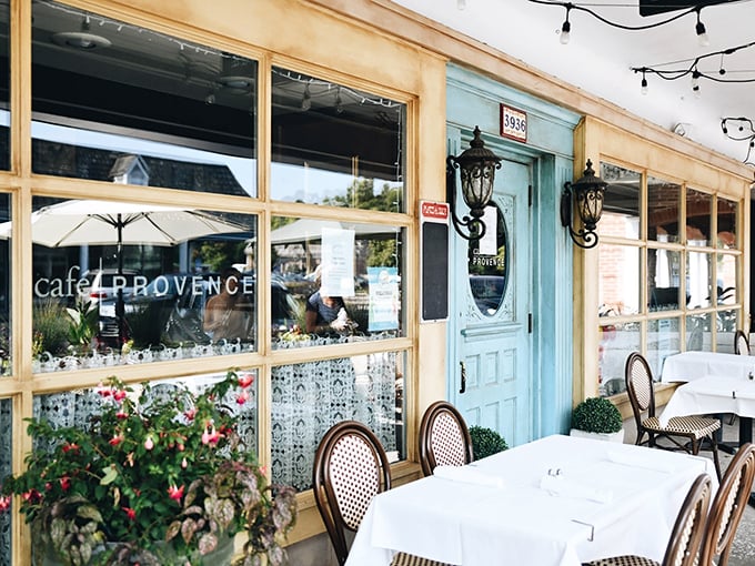 The blue door beckons like a portal to Provence – complete with charming bistro tables where you'll linger over lunch and contemplate quitting your job to become a French pastry chef.