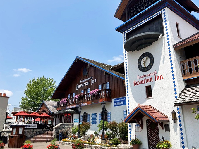 The Bavarian Inn stands like a postcard from Munich that somehow landed in Michigan, complete with clock tower and flower boxes that scream "Willkommen!"