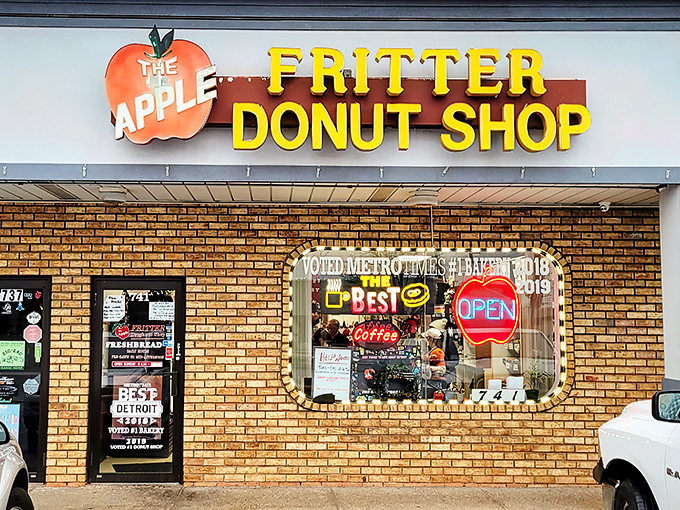 The yellow block letters against brick might not scream "culinary destination," but locals know this humble storefront houses donut royalty.
