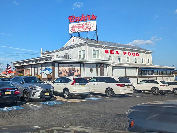 The iconic red "RESTAURANT" sign at Bahrs Landing isn't just advertising—it's a beacon of hope for seafood lovers navigating the Jersey Shore in search of their next great meal.