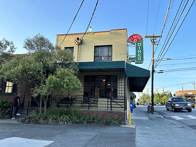 The unassuming yellow exterior of Elmo's Diner stands like a beacon of breakfast hope on Durham's Ninth Street, promising comfort within its walls.