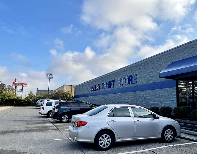 The blue-trimmed exterior of Valley Thrift Store stands like a beacon of bargain possibilities, promising treasure hunts that begin the moment you park your car.