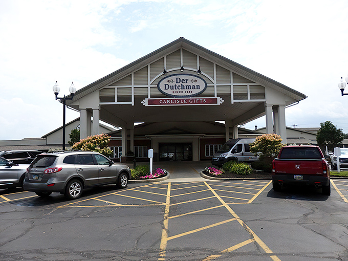 Der Dutchman's welcoming facade stands like a beacon of buttery hope along US-42, where both sedans and horse-drawn buggies find common parking ground.