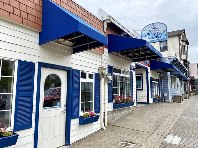 The classic coastal charm of The Chowder Bowl beckons like an old friend, its blue-trimmed facade promising seafood salvation after a long drive.
