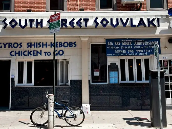 The iconic blue and white façade of South Street Souvlaki stands out like a Mediterranean beacon on Philadelphia's eclectic South Street. Greek paradise awaits!