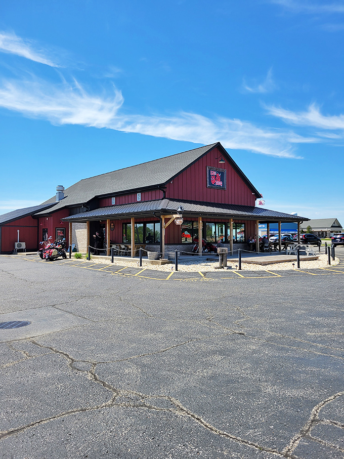 The red barn-style building stands like a beacon of barbecue hope against Wisconsin's blue sky. Meat pilgrims, your journey ends here.