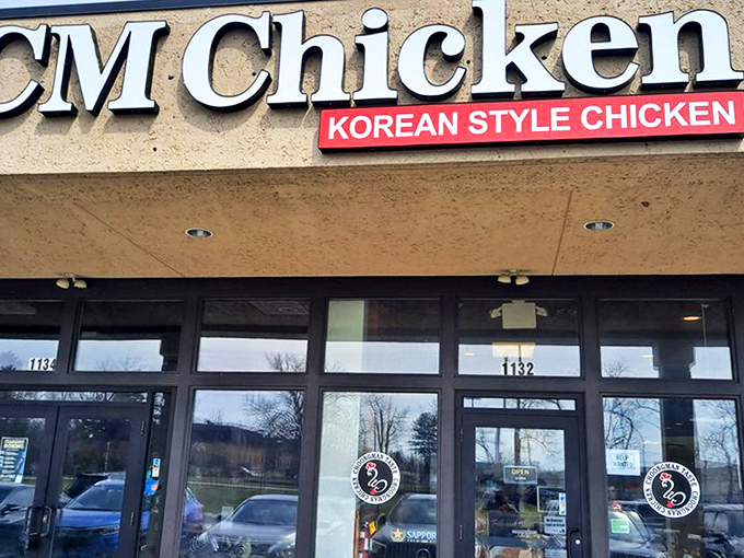 The rooster logo beckons from storefront windows, a humble façade hiding Columbus's Korean fried chicken revolution. Like finding Shakespeare performing in a strip mall.
