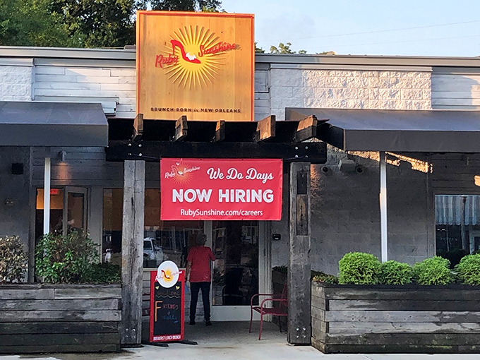 Ruby Sunshine's welcoming exterior beckons breakfast enthusiasts with its distinctive sun logo, promising morning delights worth setting your alarm for.