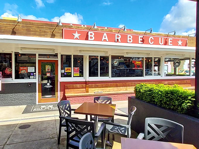 The iconic red exterior with its bold "BARBECUE" sign promises smoky delights within. Like a barbecue beacon calling to hungry travelers.