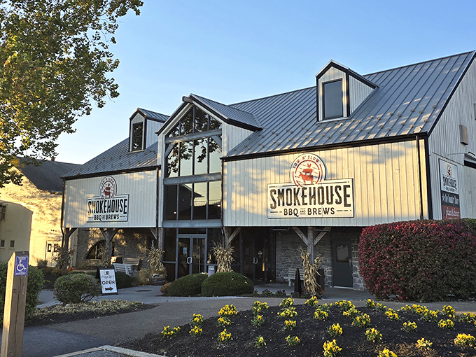 The barn-inspired architecture of Smokehouse BBQ & Brews stands proudly against the Pennsylvania sky, promising smoky delights within those wooden walls.