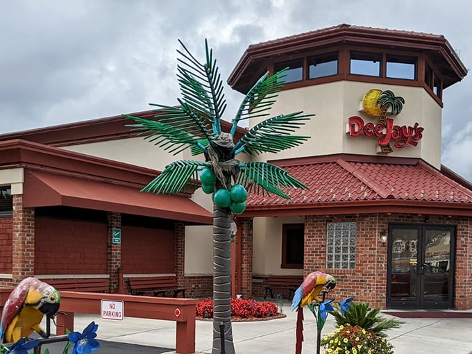 That iconic tower with its sunny yellow logo and palm tree is like a lighthouse for hungry souls—guiding barbecue pilgrims home through the West Virginia hills.